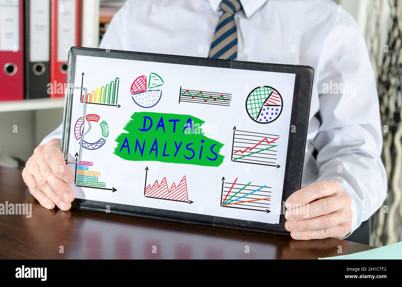 Data analysis concept shown by a businessman Stock Photo - Alamy