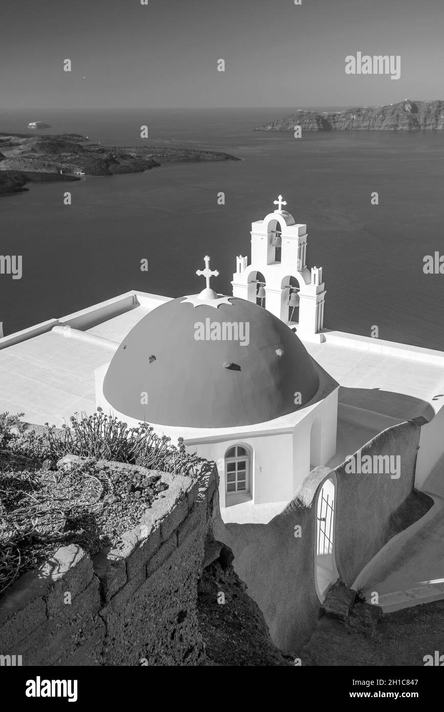 Three Bells of Fira in Santorini, Greece with blue sky in black and ...