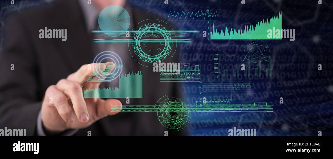 Man touching a digital analytics concept on a touch screen with his ...