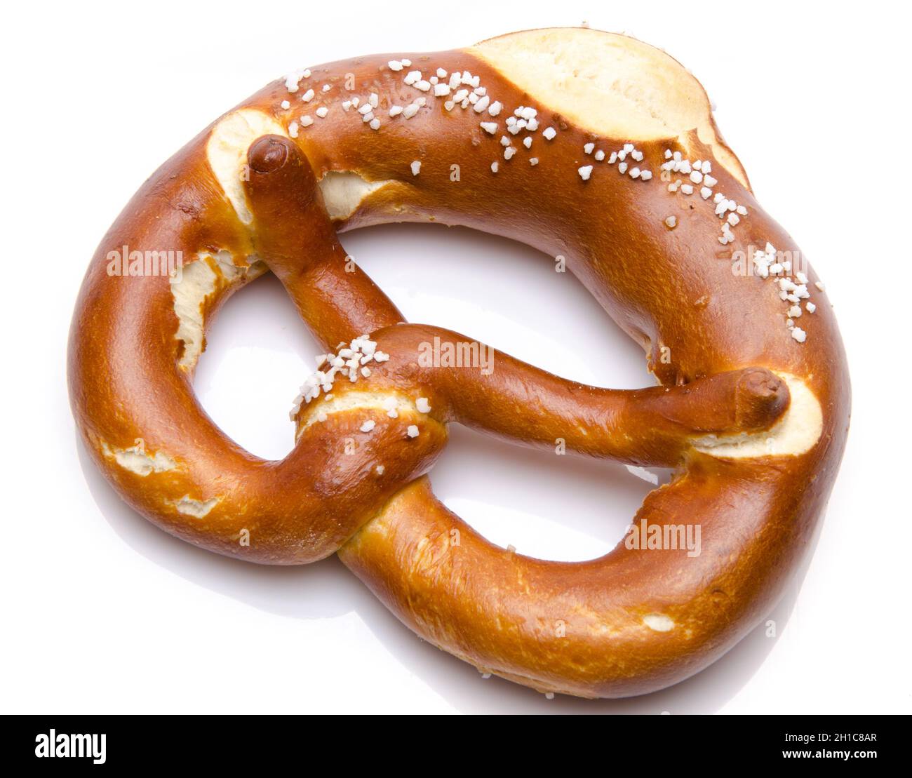 A fresh bretzel, isolated on white Stock Photo - Alamy