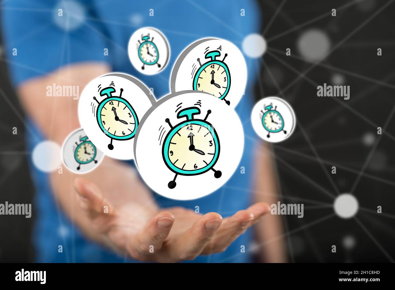 Time concept above the hand of a man in background Stock Photo - Alamy
