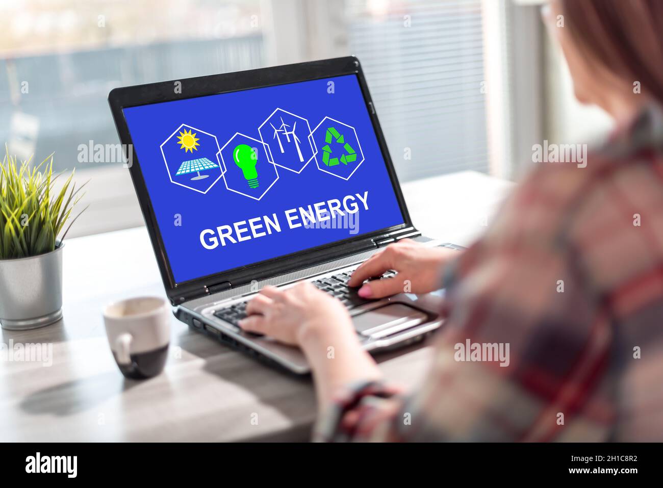 Laptop screen displaying a green energy concept Stock Photo - Alamy