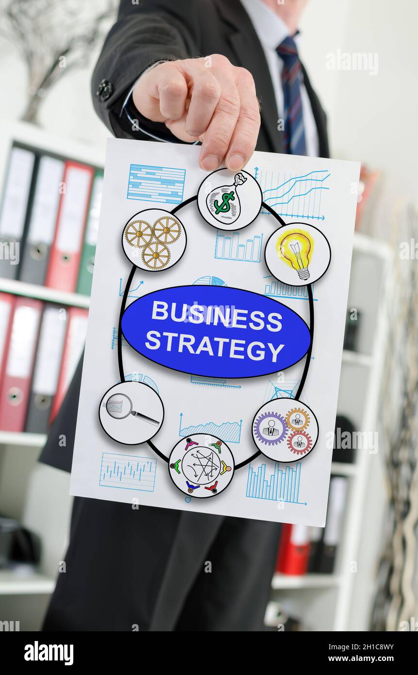 Paper showing business strategy concept held by a businessman Stock ...