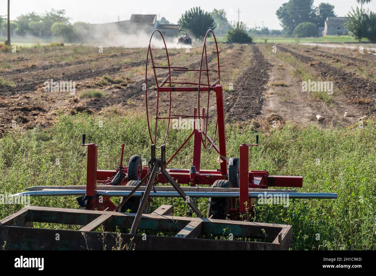 Tillage implement in the middle of the soil waiting to be used to ...