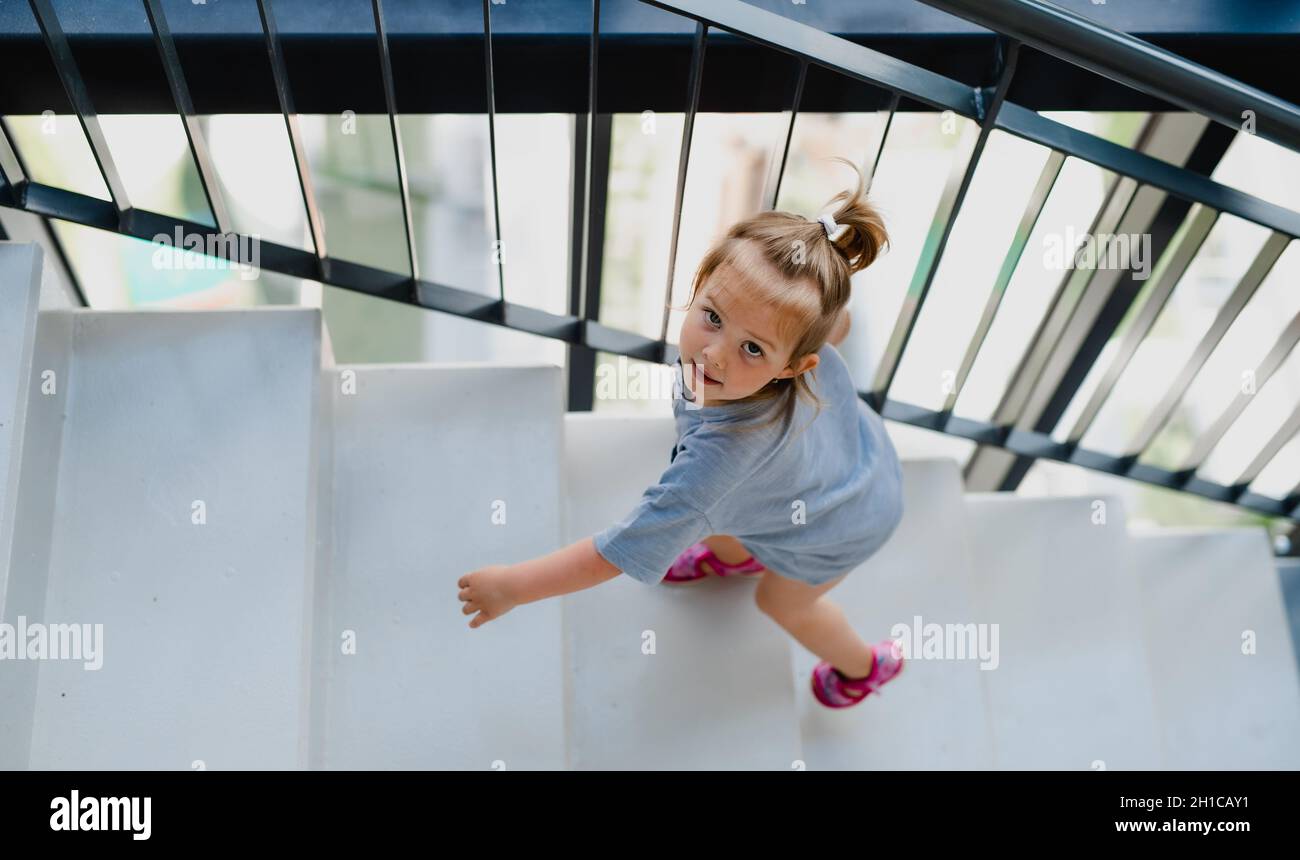 Girl walking up stairs hi-res stock photography and images - Alamy