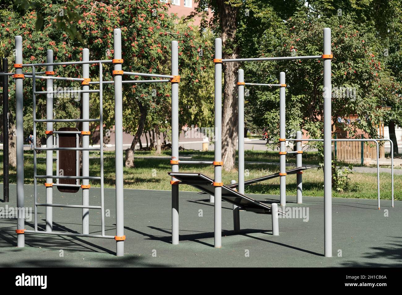 Sportsground with group of metallic parallel bars for outdoor training ...