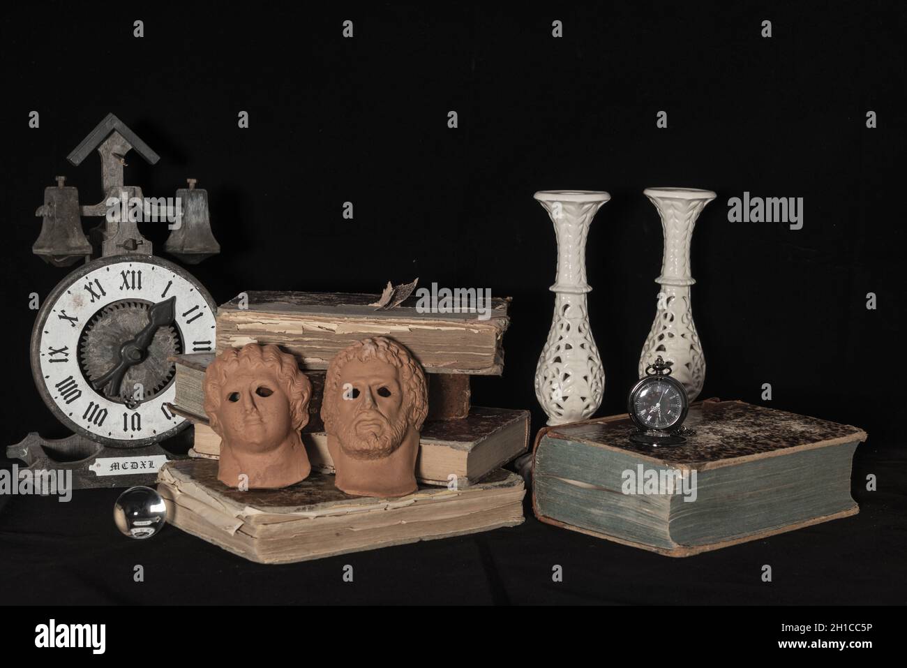 Reproductions of Greek gods on classical books on a black background ...