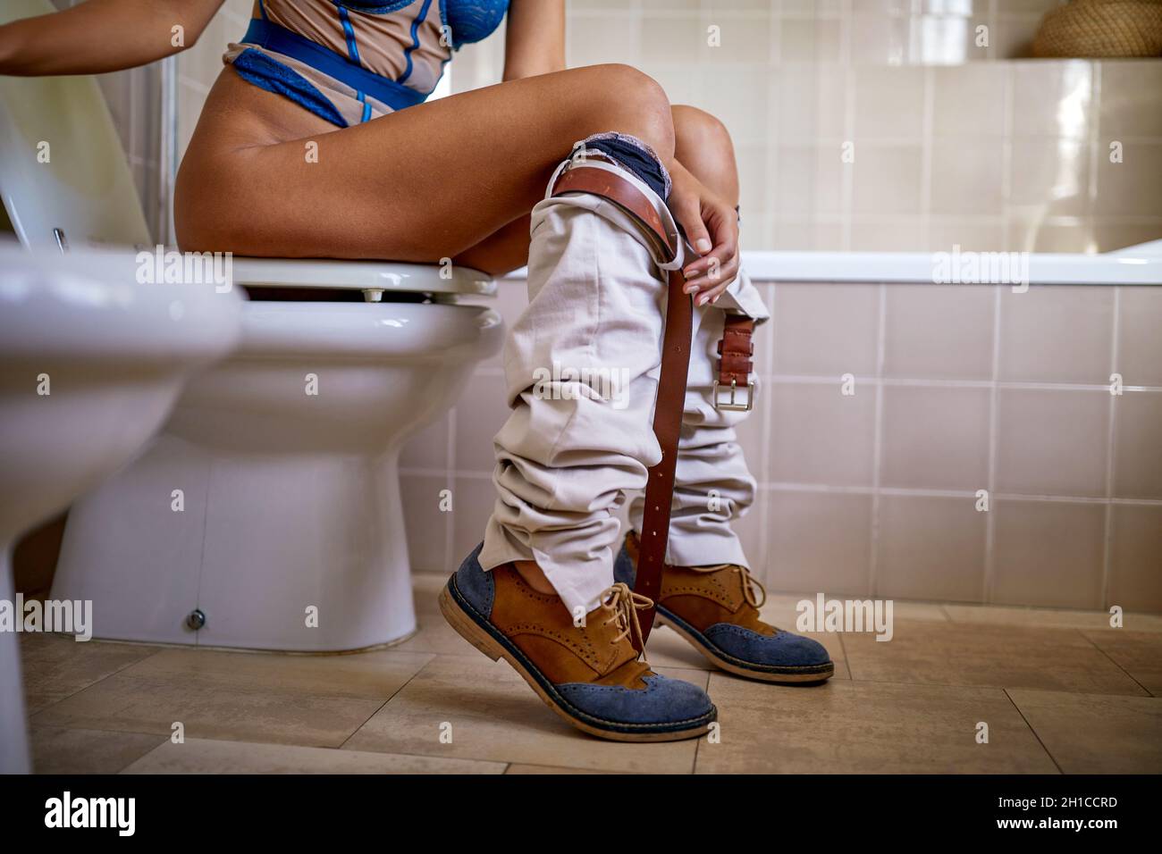 Young woman having constipation problems on the toilet Stock Photo - Alamy