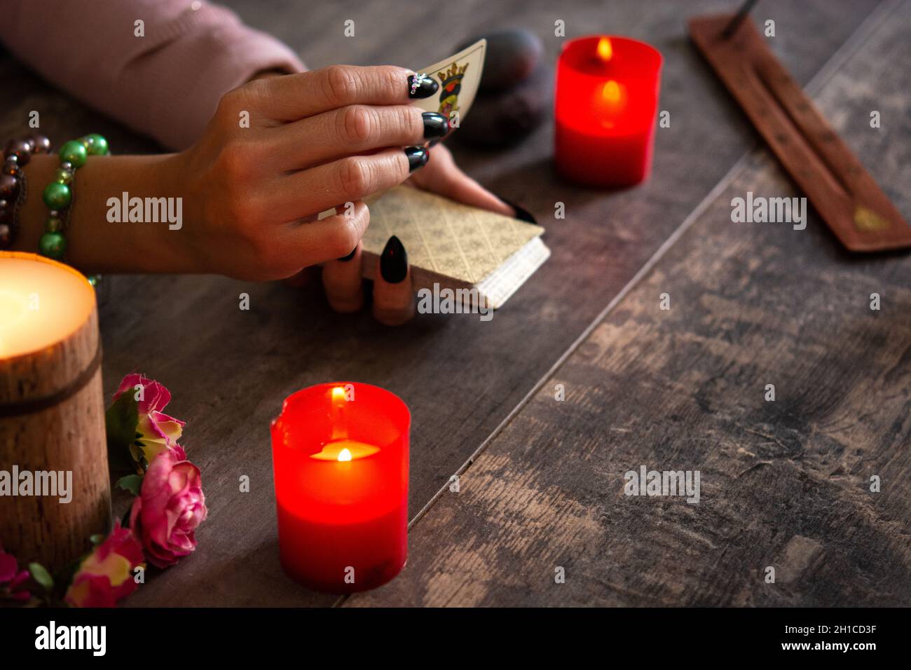 Fortune teller reading a future by tarot cards on rustic table Stock ...