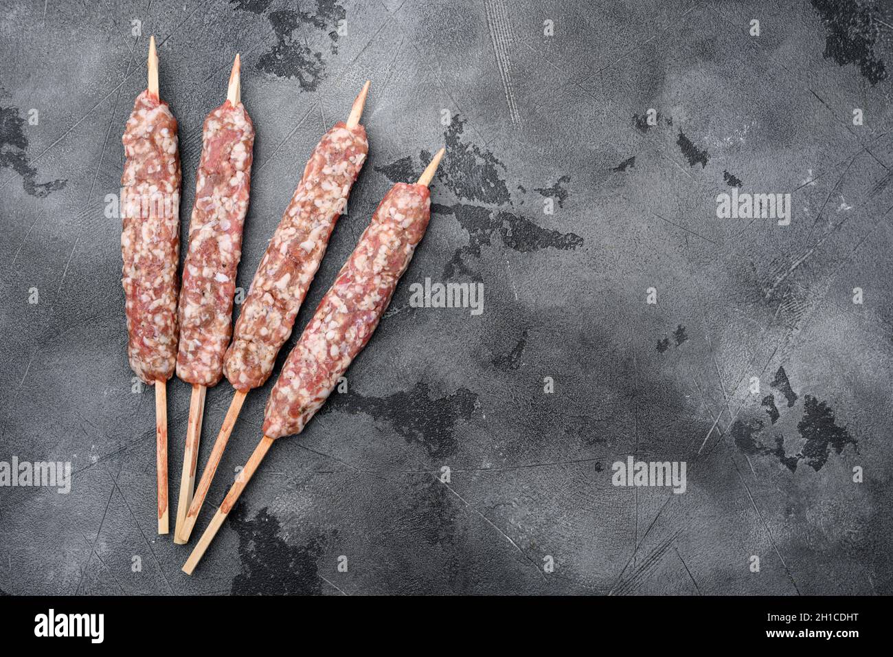 Raw mutton kebab shish skewers set, on gray stone table background, top ...