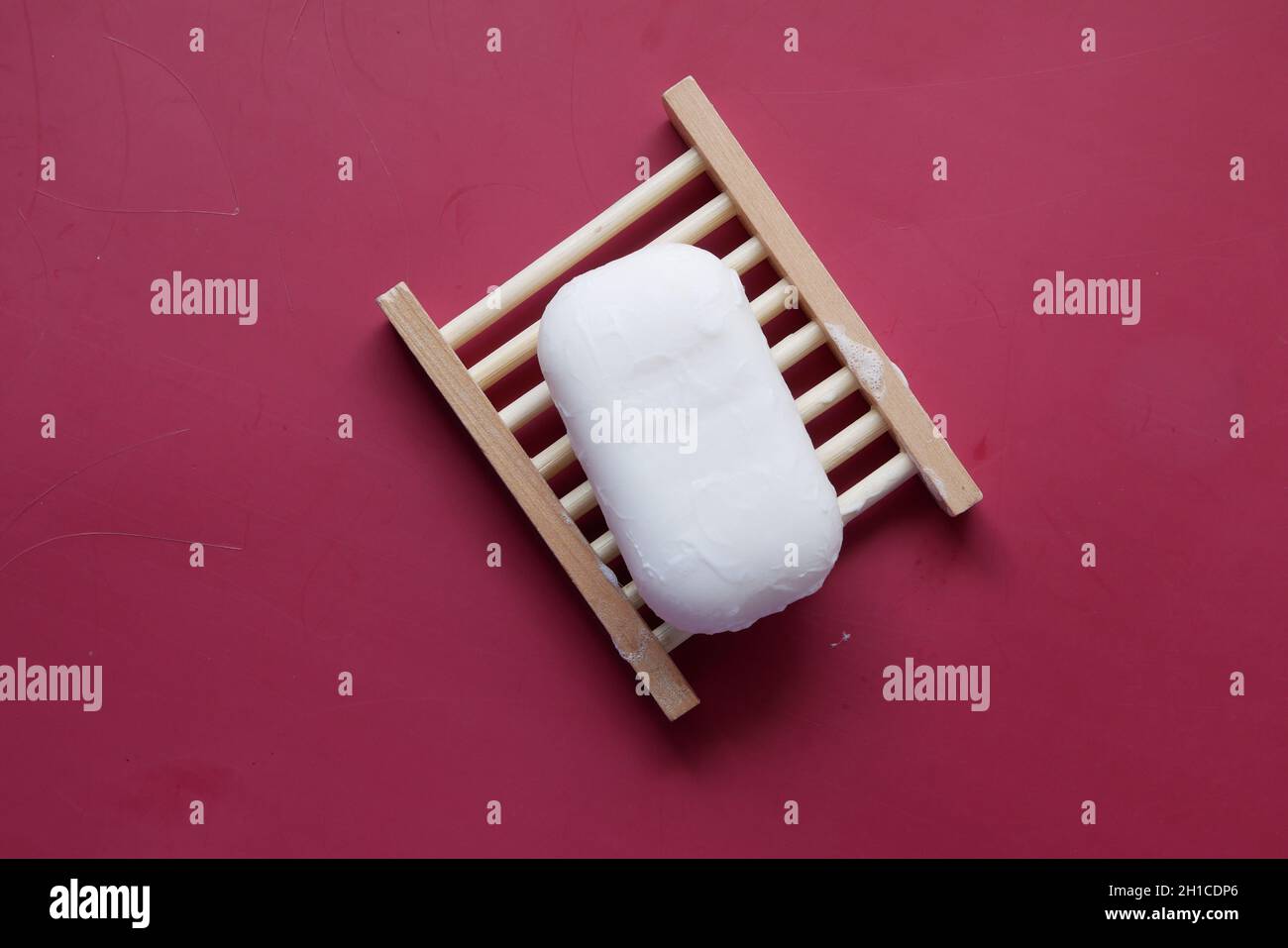 Soap and bubbles on a case on color background Stock Photo - Alamy