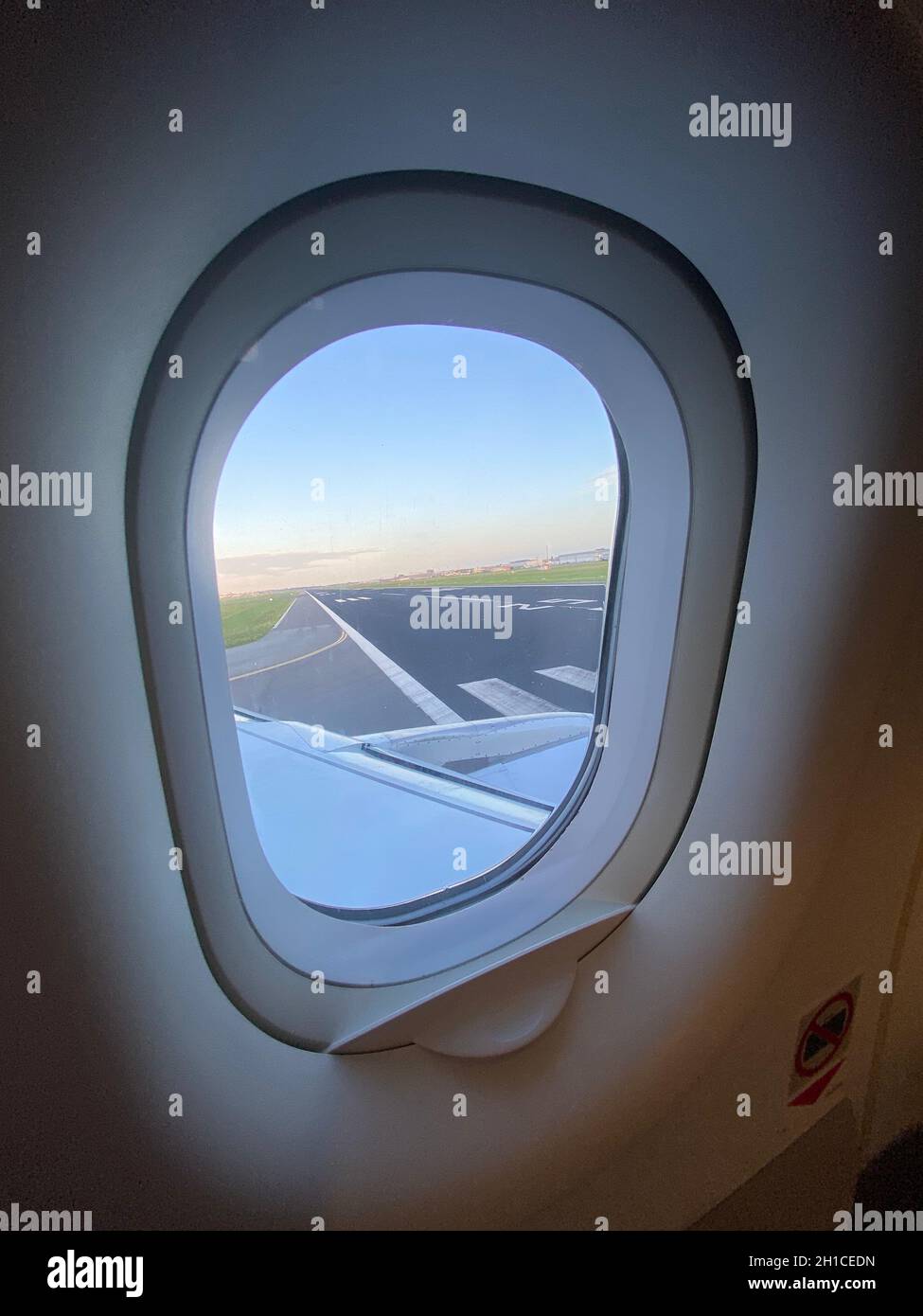 Airfield seen through an airplane window before takeoff or after ...