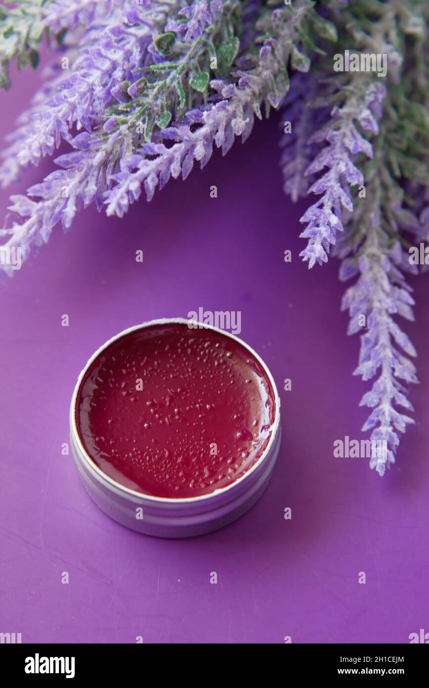 purple color petroleum jelly in a container Stock Photo - Alamy