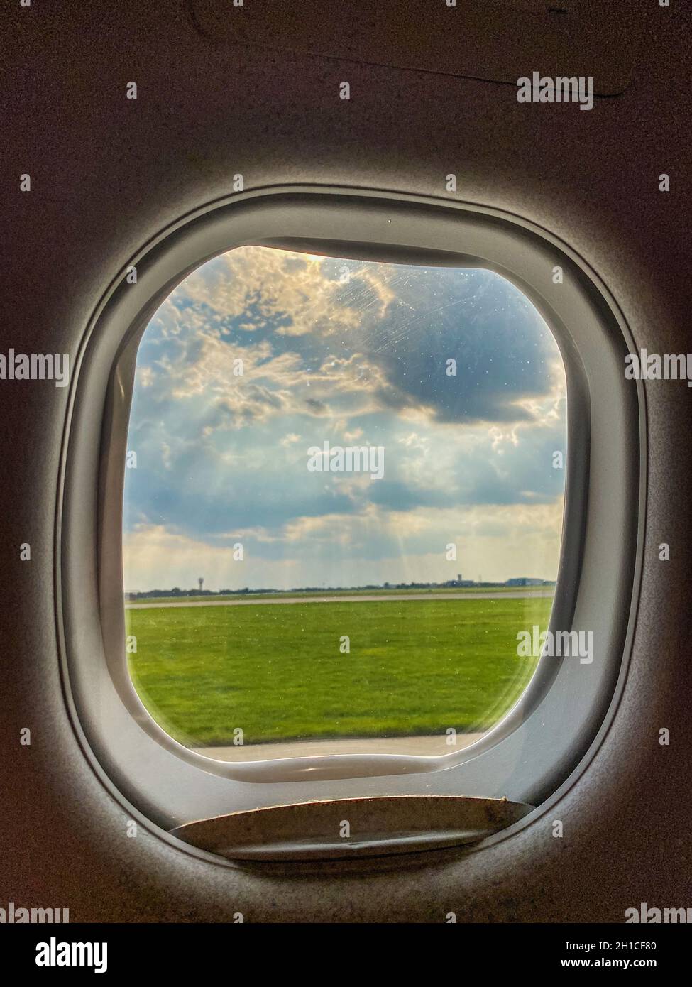 Airport Airfield seen through an airplane window before takeoff or ...