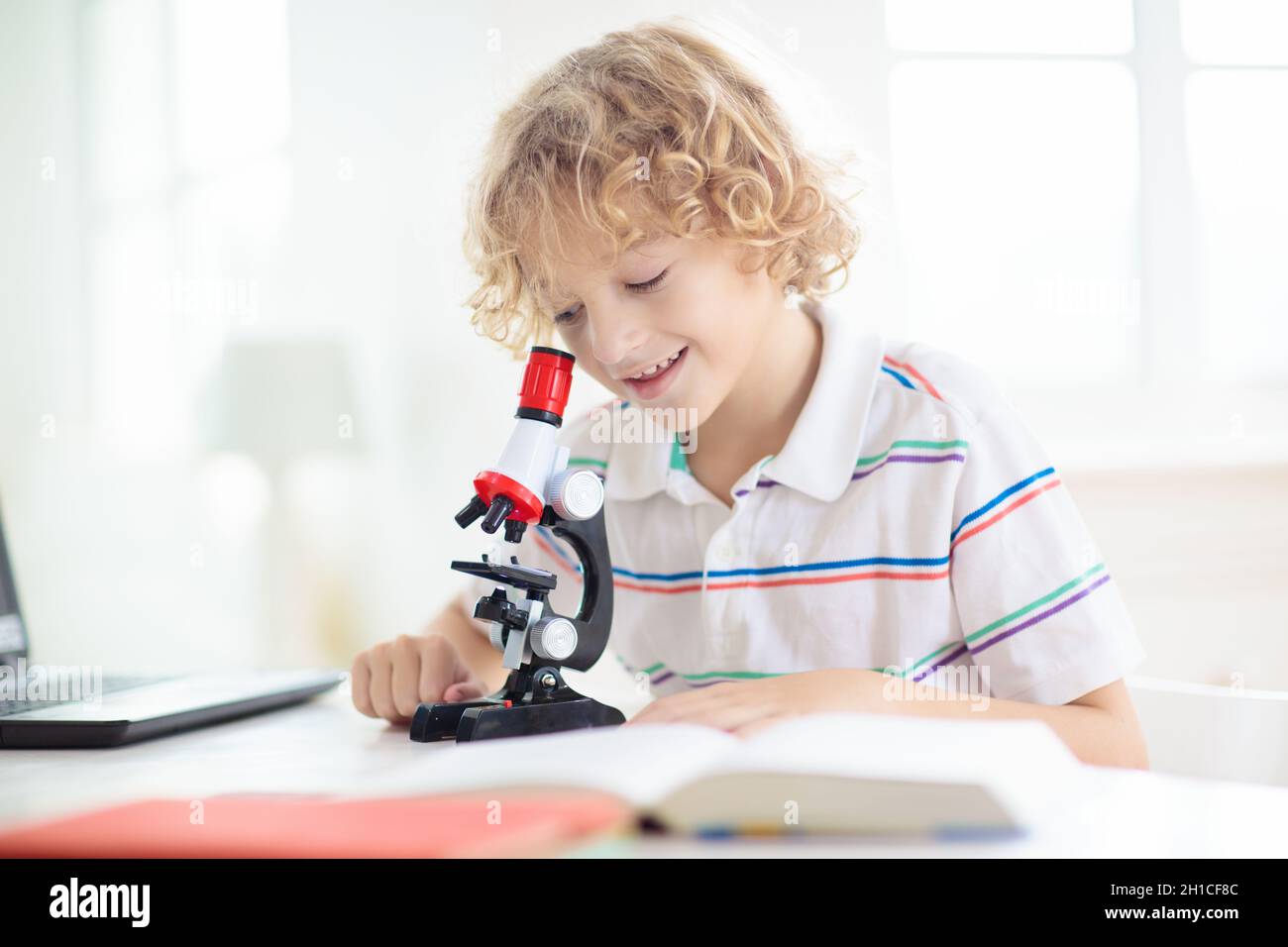 School kids with microscope. Science class. Children making biology or ...