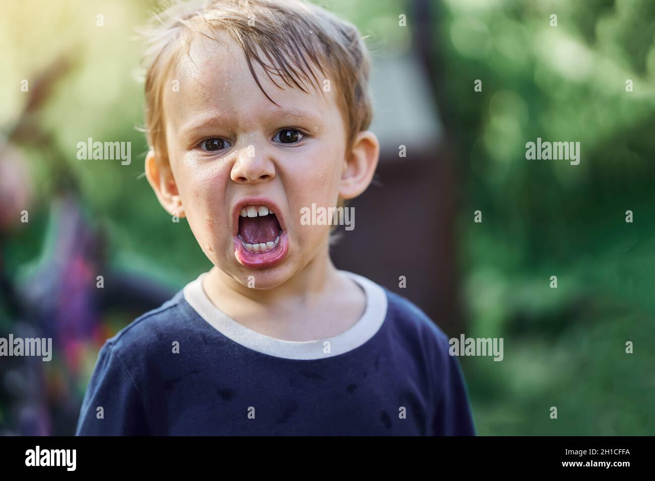 Sad kid at the park hi-res stock photography and images - Alamy