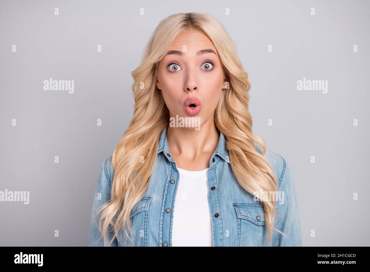 Photo Of Impressed Shocked Young Woman Dressed Denim Shirt Big Eyes
