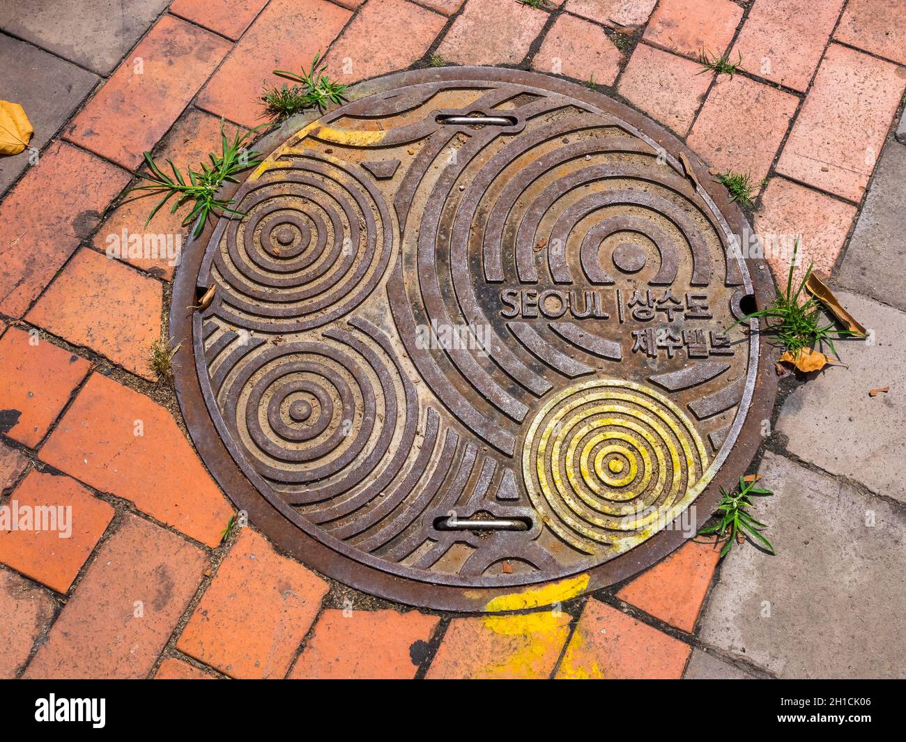 Seoul, South Korea - June 25, 2017: Round sewer hatch on the street in ...