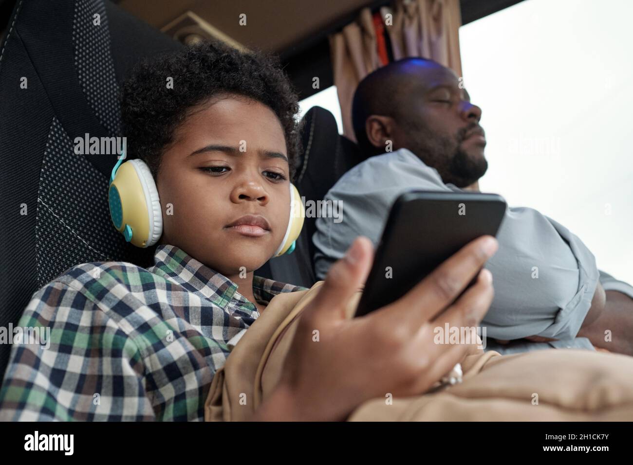 Boy smartphone bus hi-res stock photography and images - Alamy