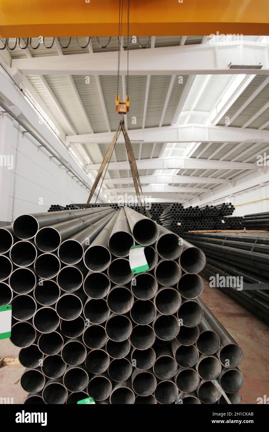 steel metal pipe stack inside factory Stock Photo - Alamy