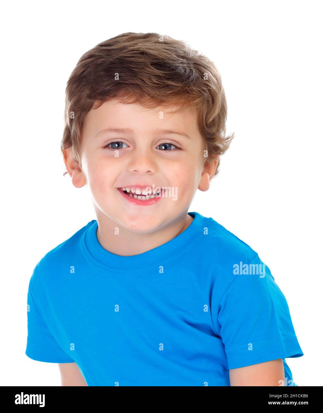Nice smiling little boy looks at the camera dressed in blue T-shirt ...