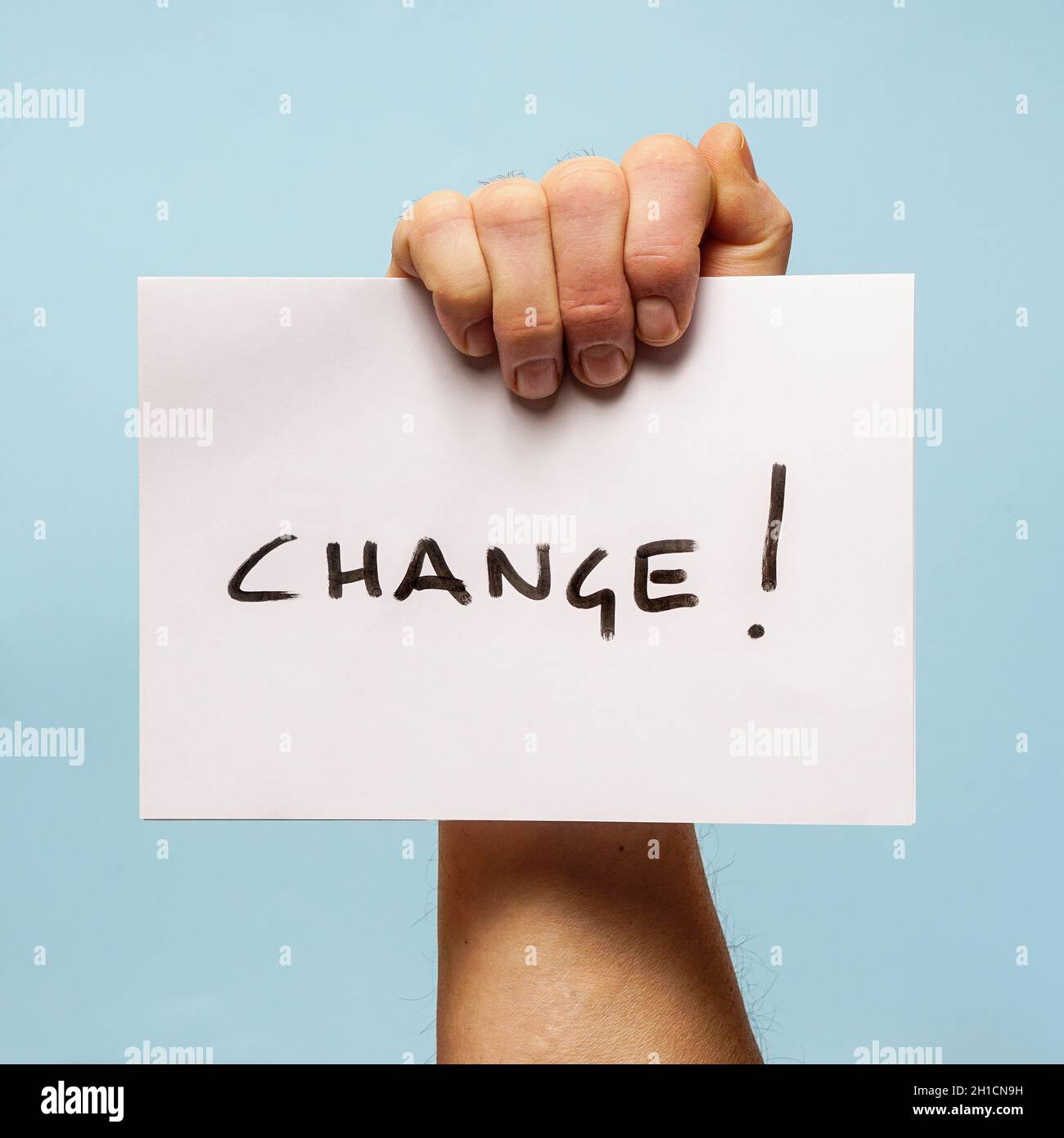 the sign in hand with the request for change Stock Photo - Alamy
