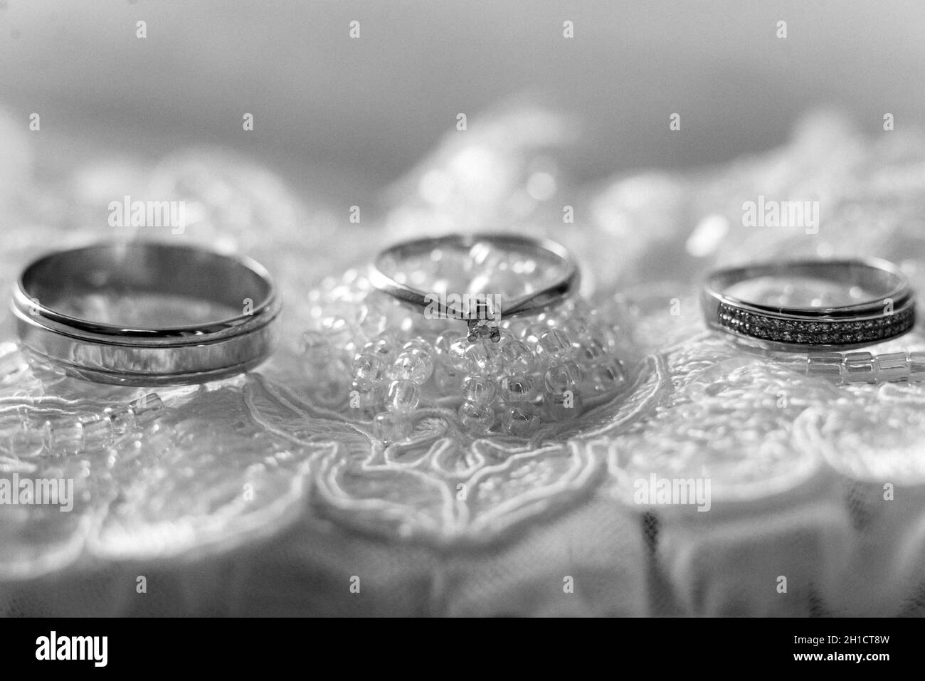 wedding rings with a wedding decor Stock Photo - Alamy