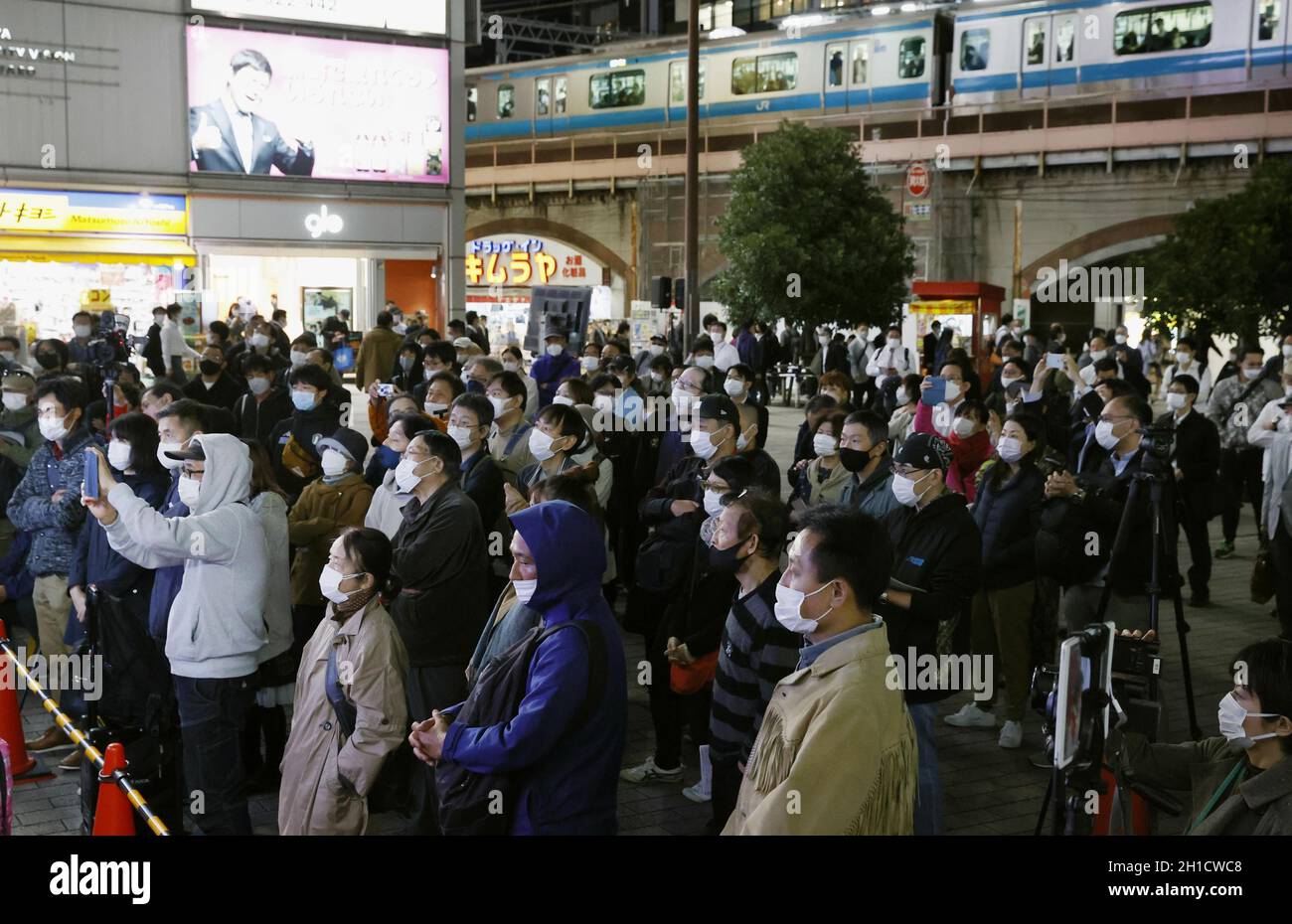 Tokyo, Japan. Oct. 18, 2021: People listen to a politician giving a ...