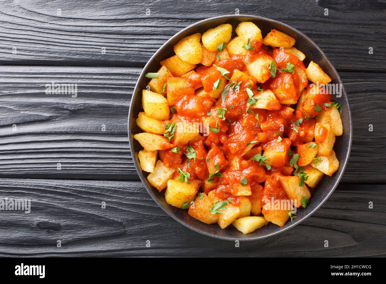 Patatas Bravas recipe fried potatoes with bravas sauce close up in the ...