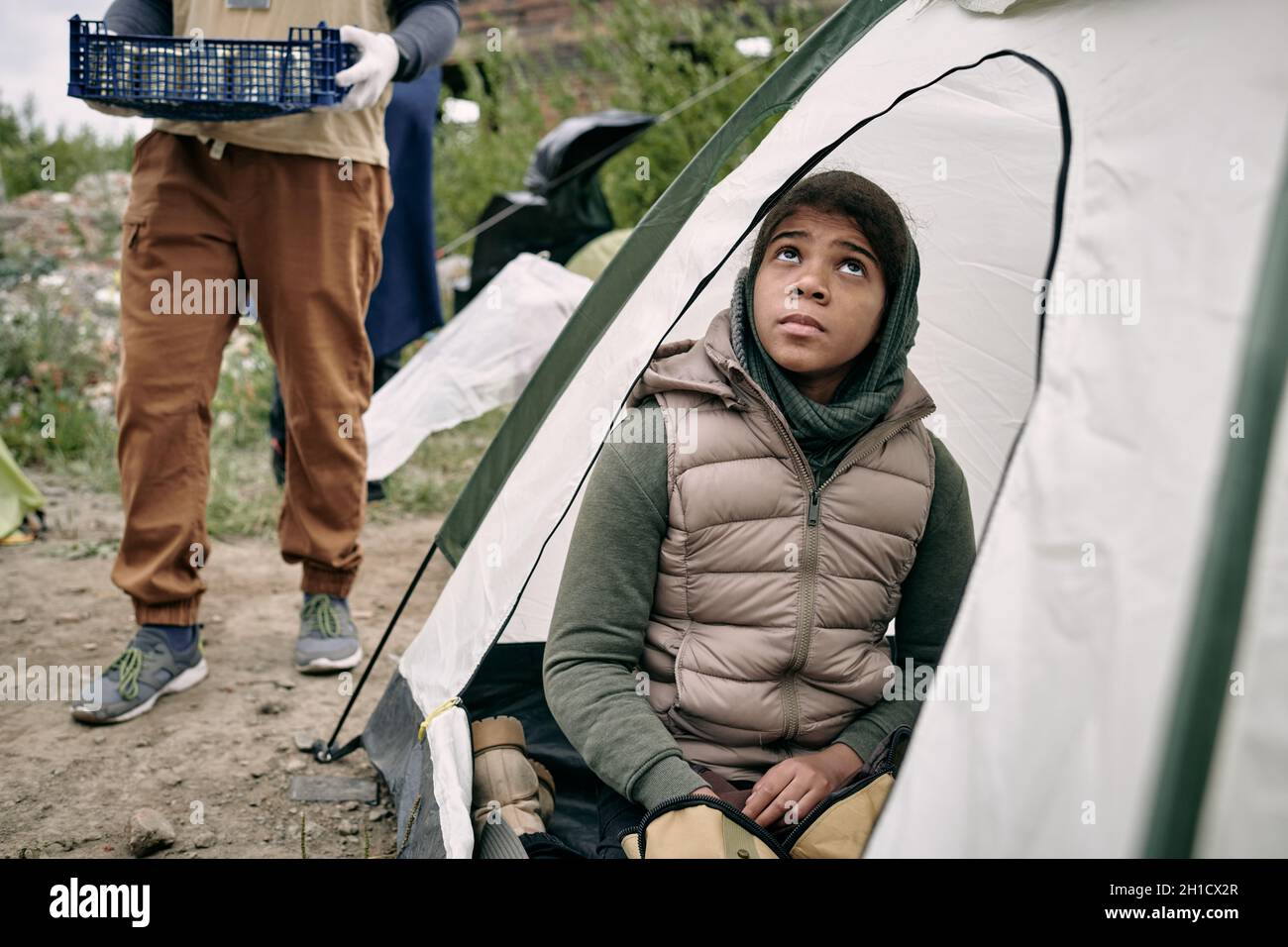 Homeless girl sitting on hi-res stock photography and images - Alamy