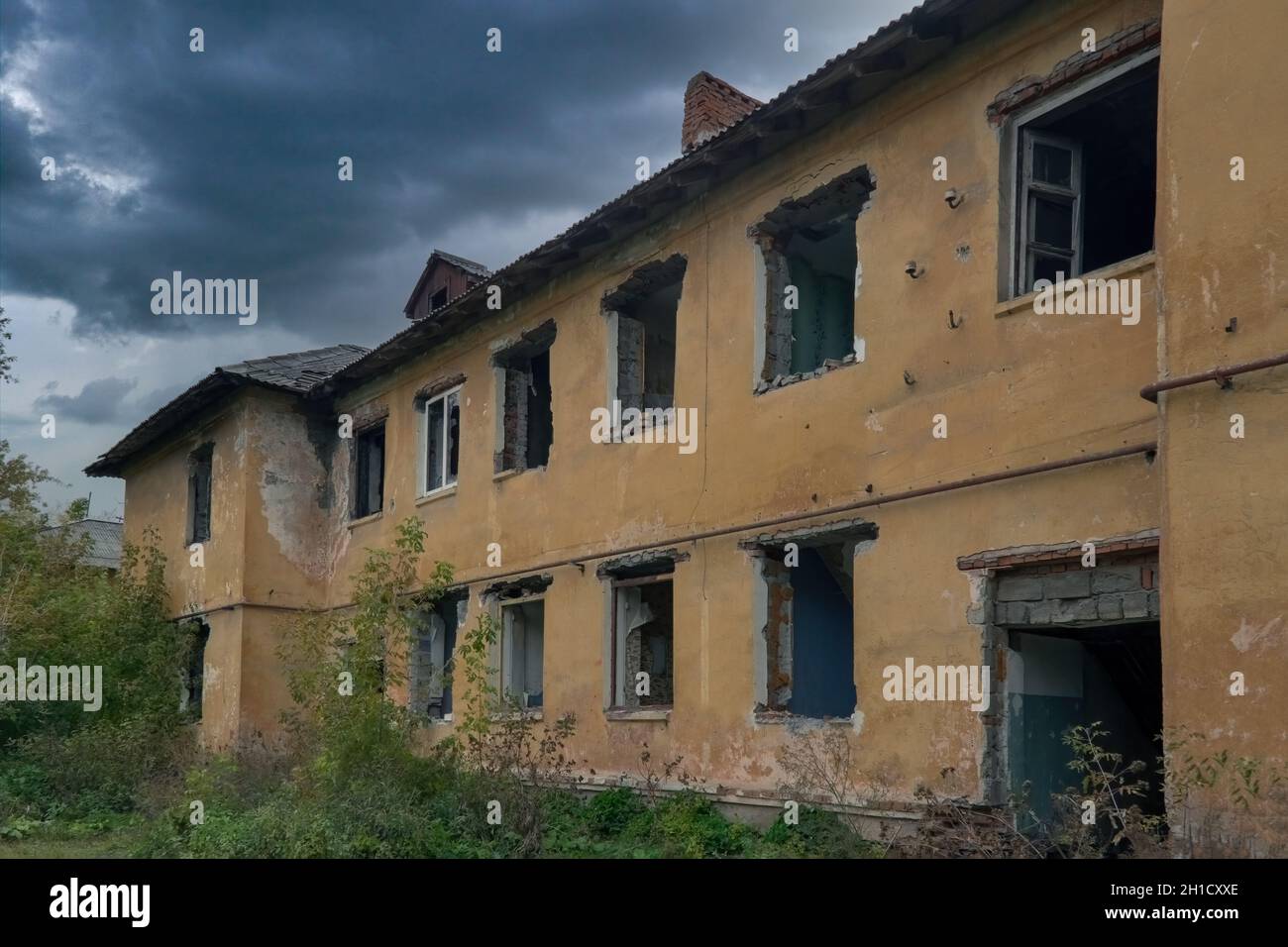 The ruins of a destroyed building in the city. Old abandoned collapsing ...