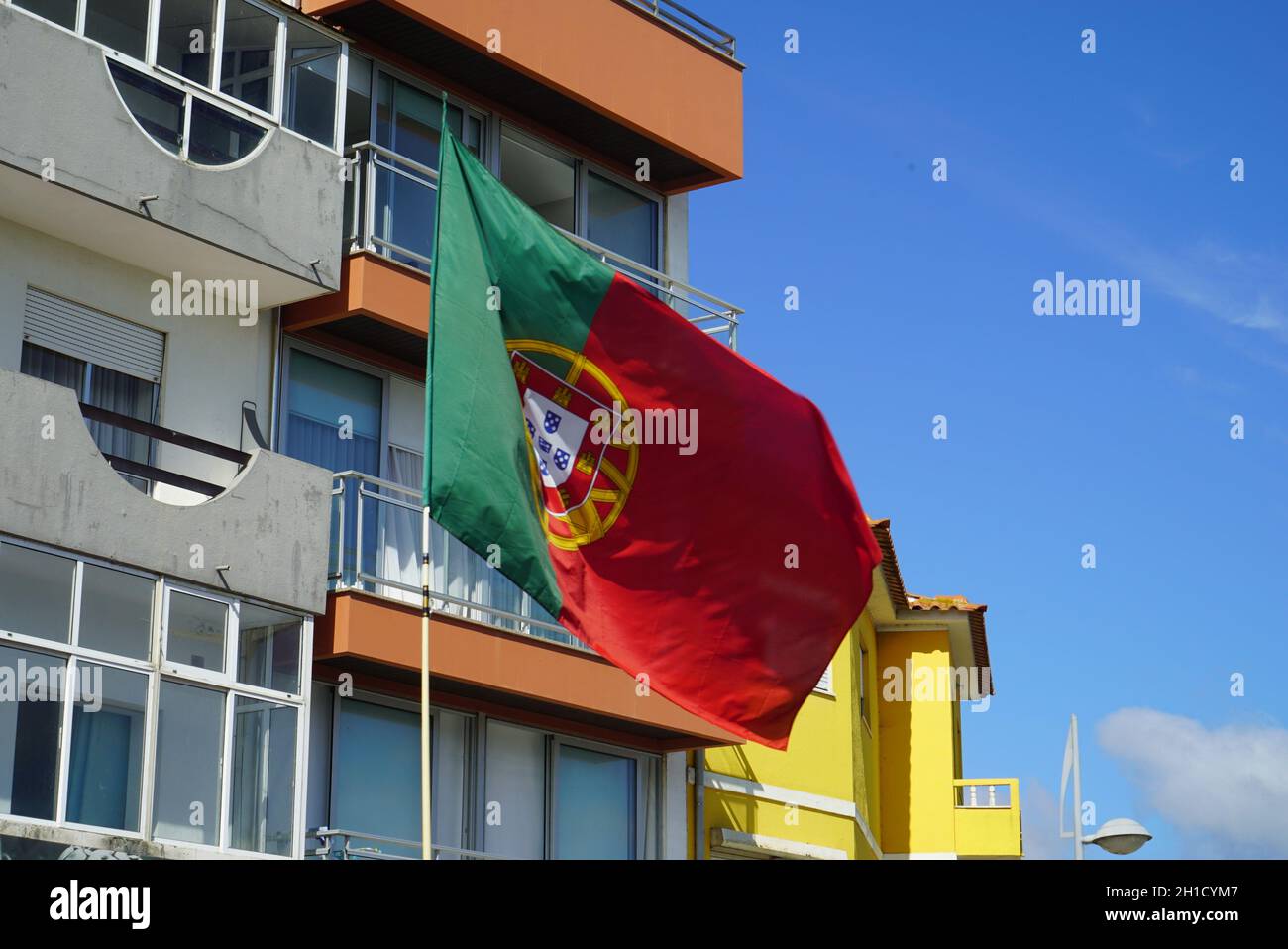 Portuguese flag waving in the wind Stock Photo - Alamy