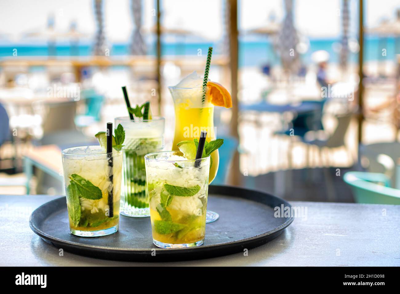 a selection of freshly made tropical alcoholic cocktails ready to serve ...