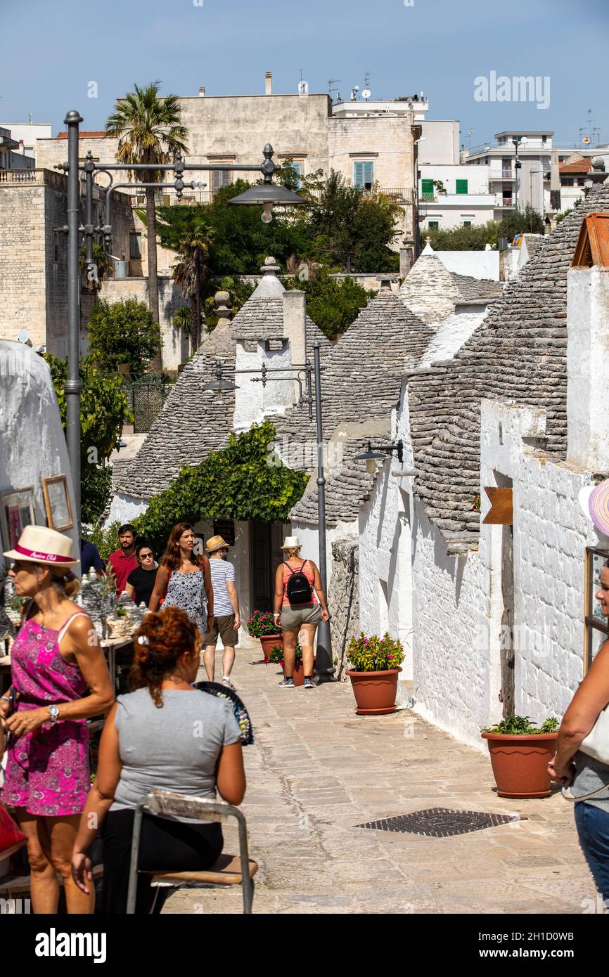 Alberobello, Italy - September 16, 2019: People visit Trulli village in ...