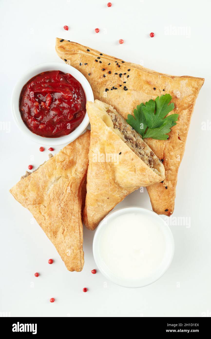 Concept of tasty food with samsa on white background Stock Photo - Alamy