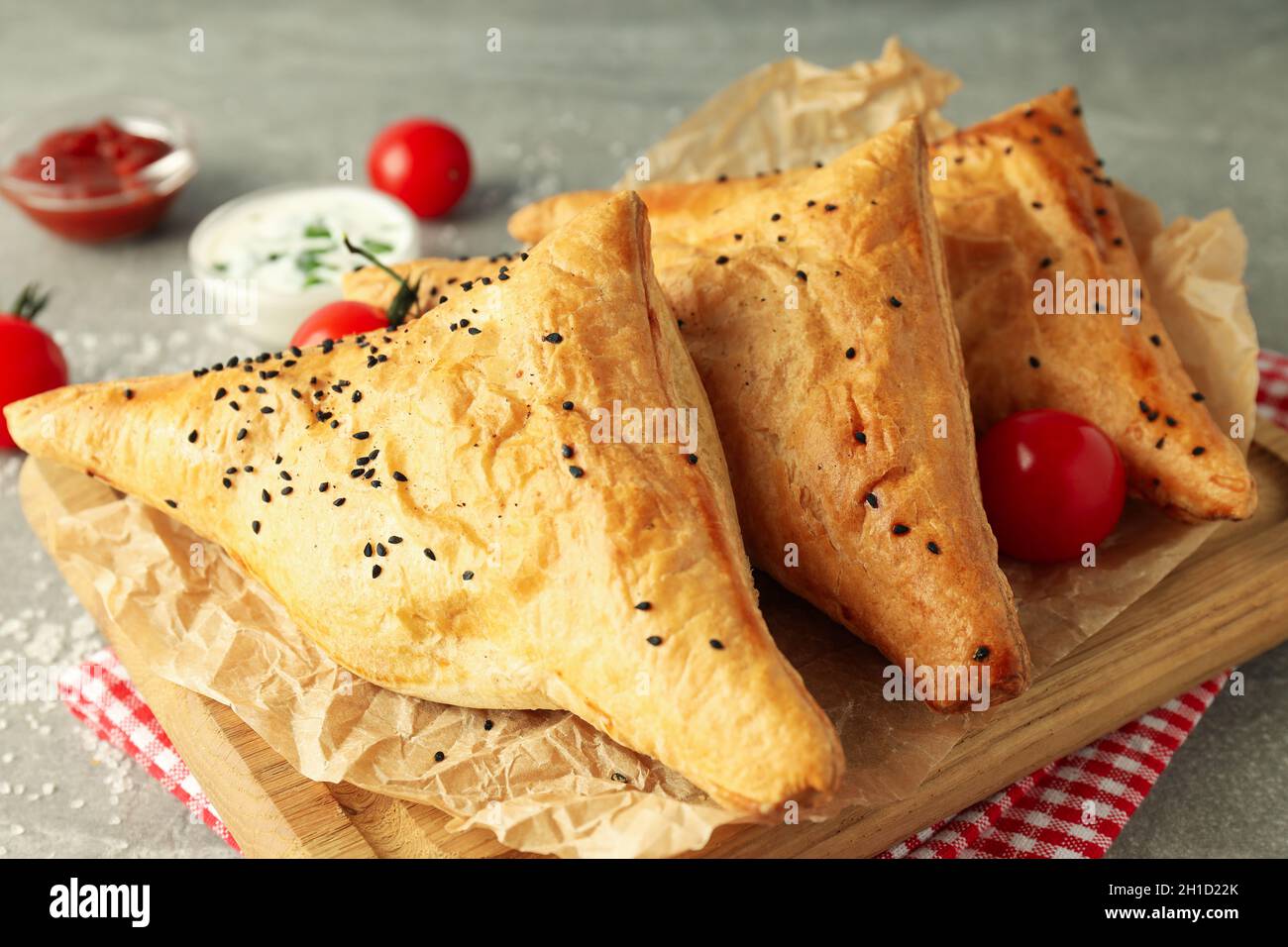 Concept of tasty food with samsa on gray background Stock Photo - Alamy