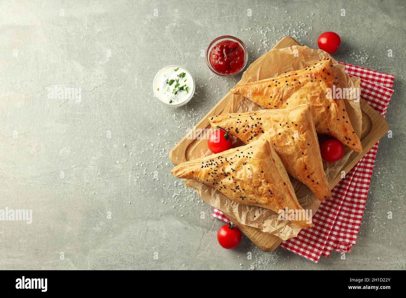 Concept of tasty food with samsa on gray background Stock Photo - Alamy