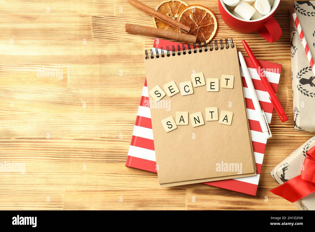 Secret Santa and Christmas composition on wooden background Stock Photo ...