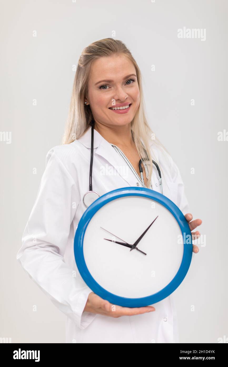 The doctor holds a wall clock in her hands and reminds you that it's ...