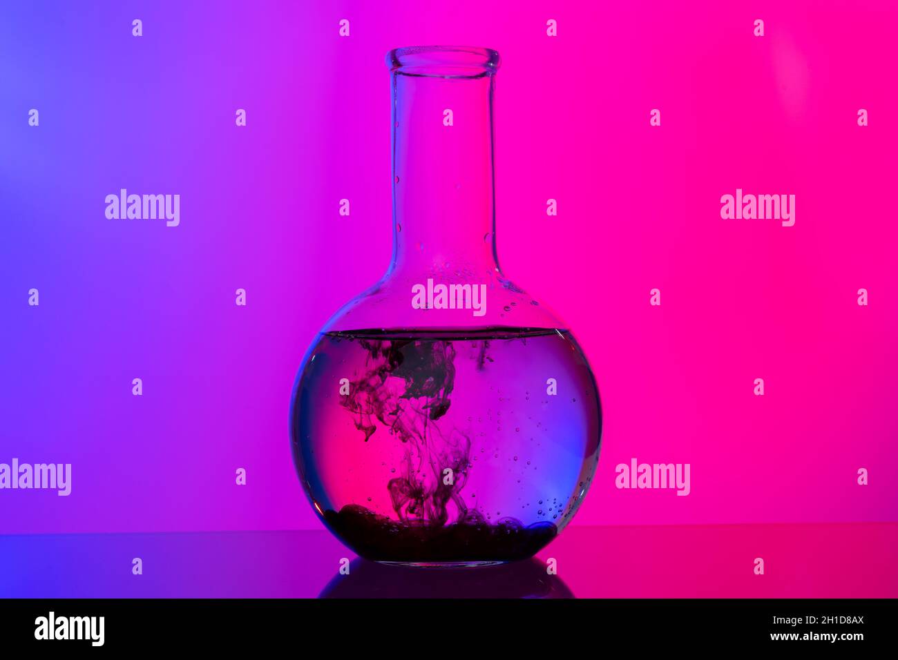 Laboratory glass tubes with chemicals on bright pink background Stock ...