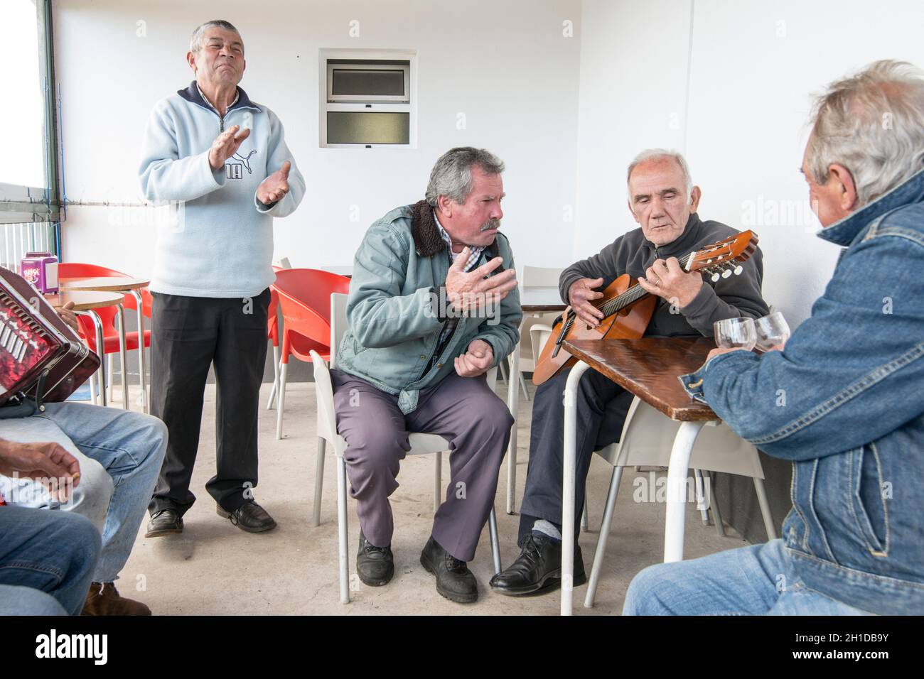 older men are singing Fado at a smal cafe bar im Monte near the city ...