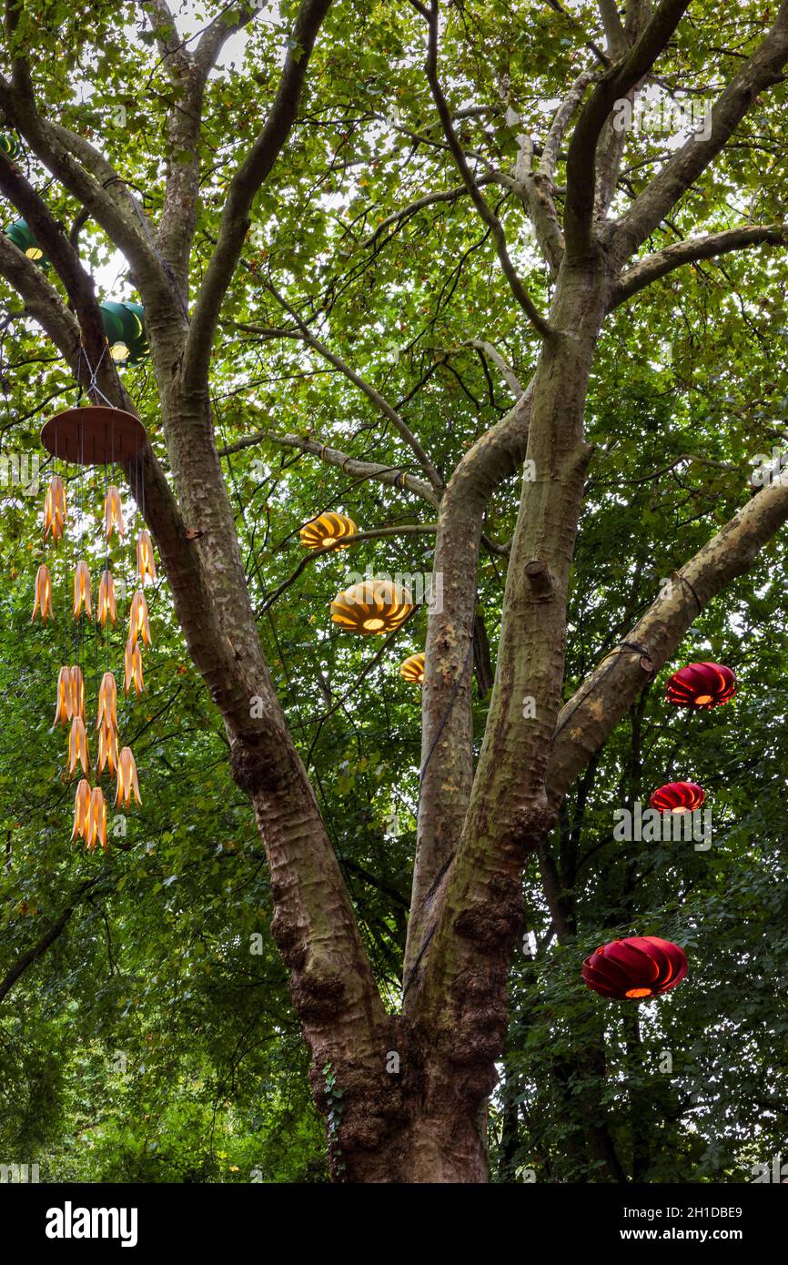 Wooden lanterns hung in trees. Designed and produced by Alex MacMaster ...