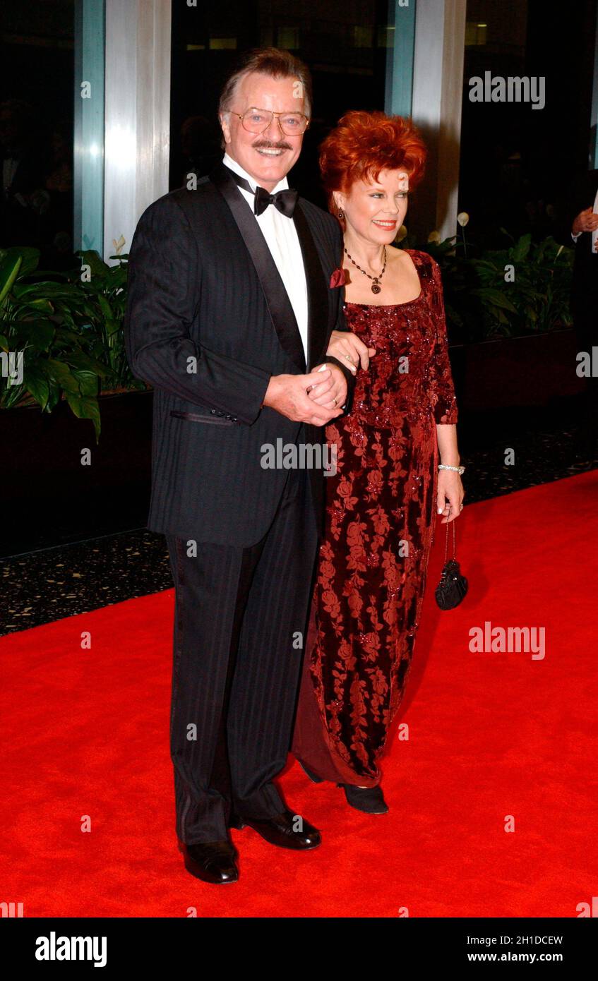 Robert Goulet and his wife, Vera Novak, arrive for a dinner hosted by ...