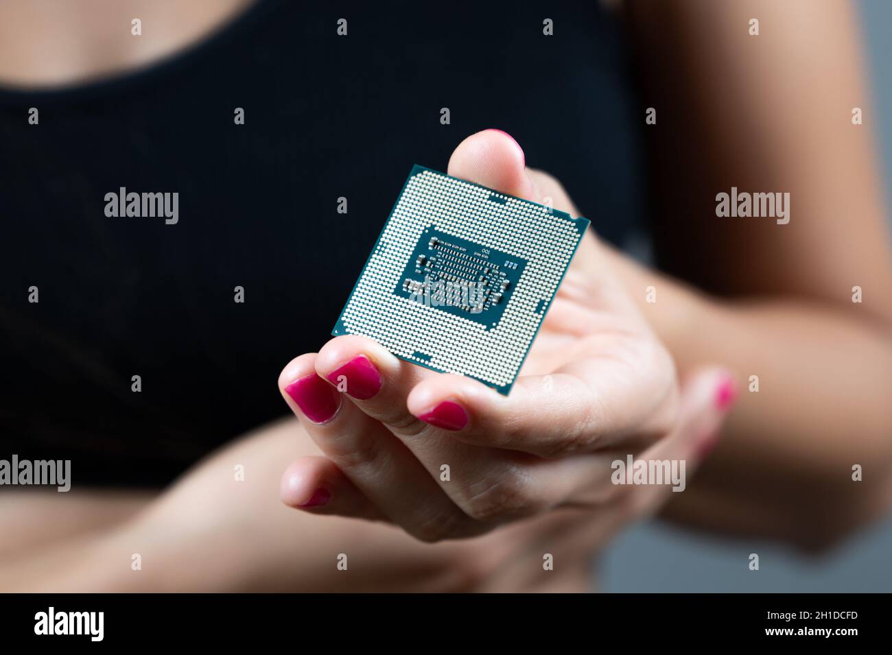 Woman's hand holding a processor Stock Photo - Alamy