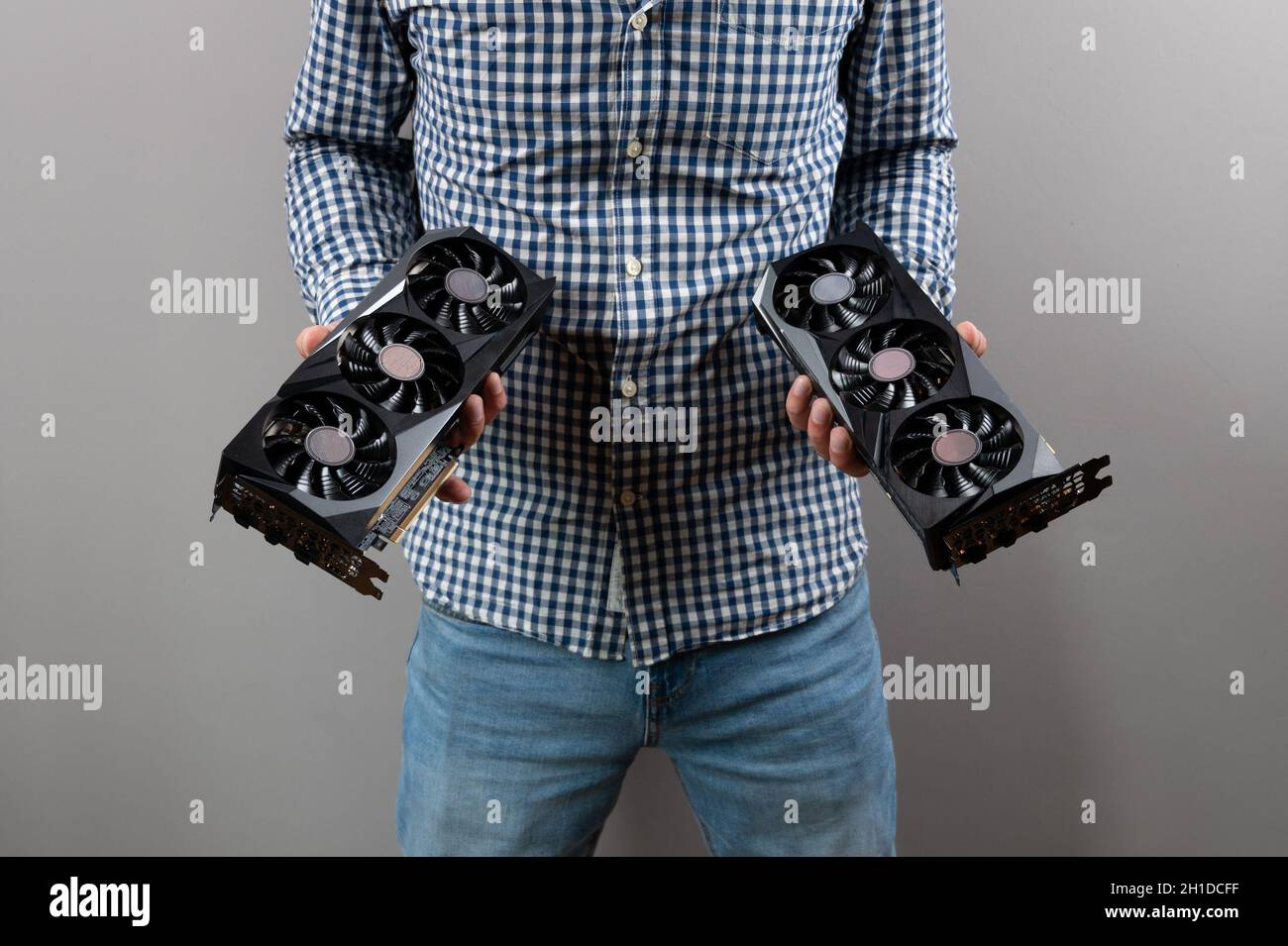 A man chooses a graphic card Stock Photo - Alamy