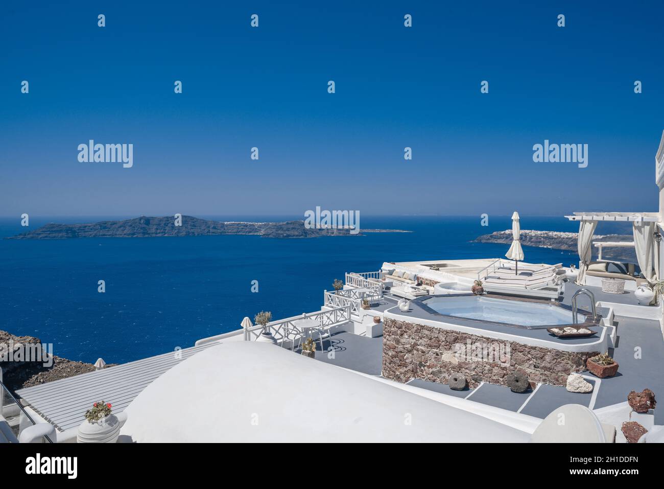 Traditional white buildings and rooftops in the villages of Santorini ...