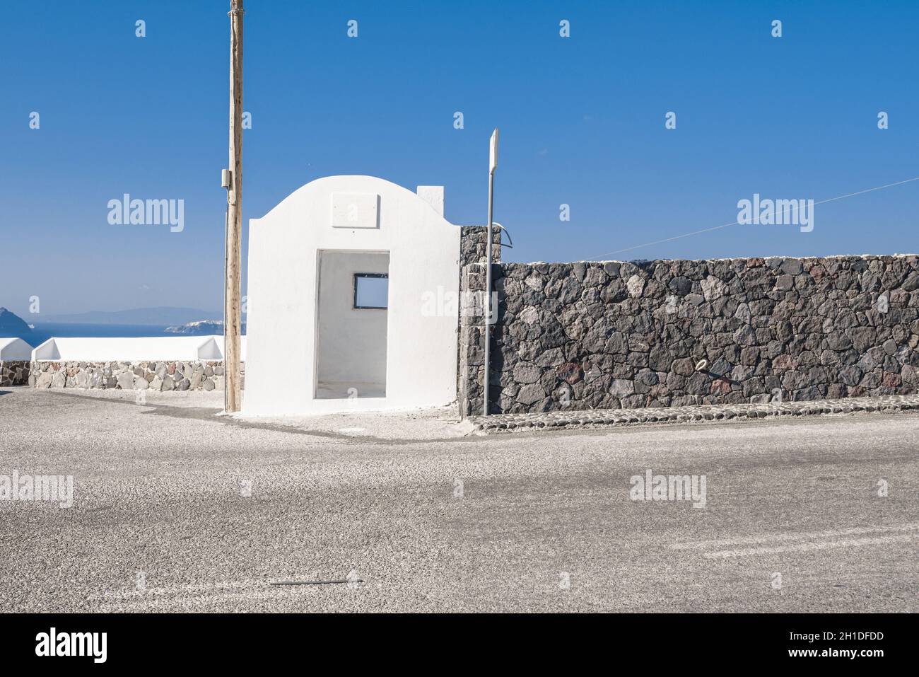 White building for bus stop in Santorini Island, Greece Stock Photo - Alamy