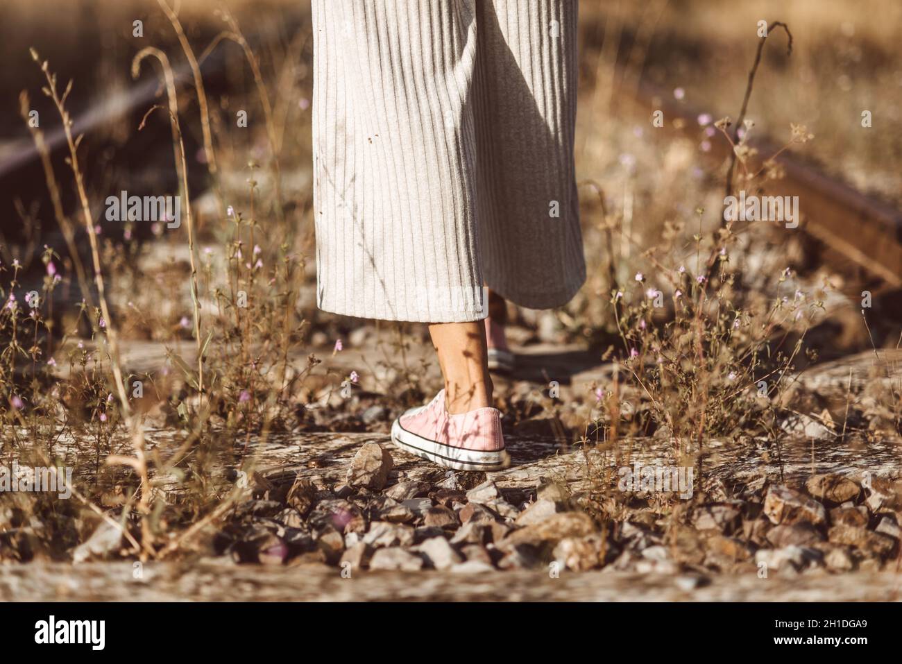 Old fashioned style photography. Back view, of of a woman standing on ...