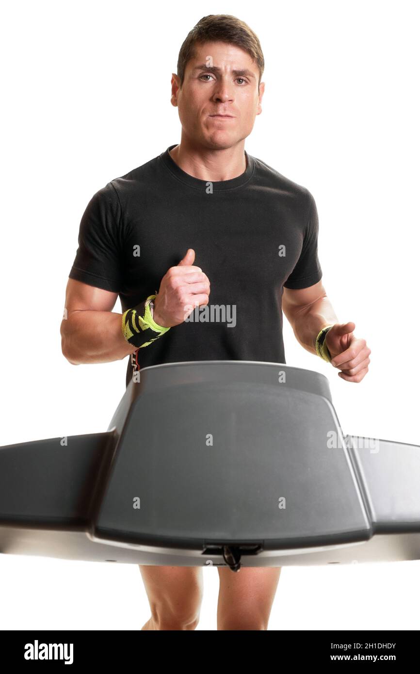 Male athlete running fast on a treadmill isolated on white background ...