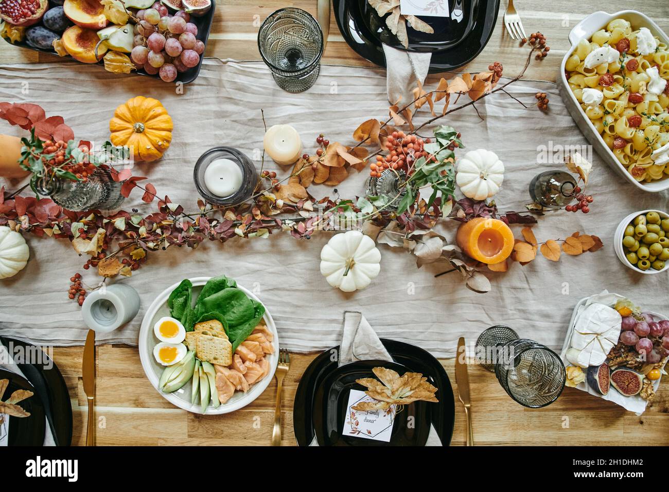 High angle view of dining table with dishes and appetizers serving on ...